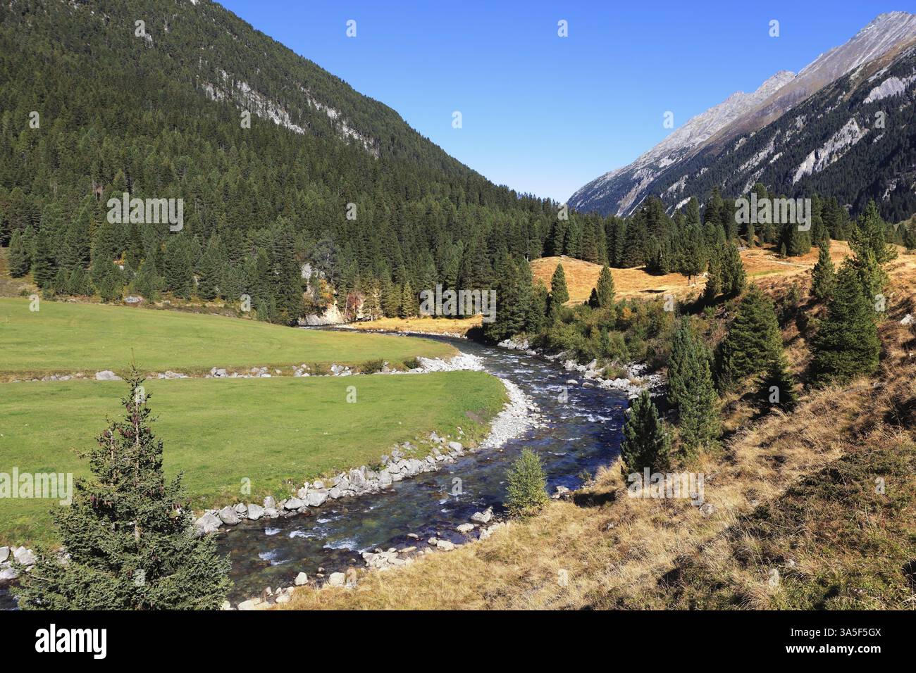 Headwaters of waterfalls - the narrow fast river among green mountain ...