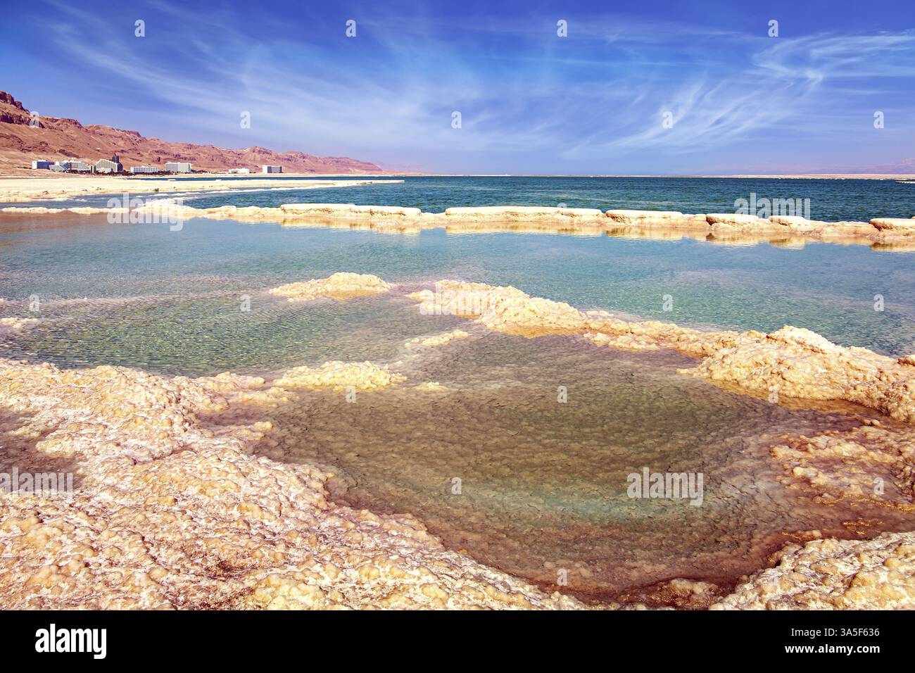 The evaporated salt forms bizarre patterns on the surface of the water ...