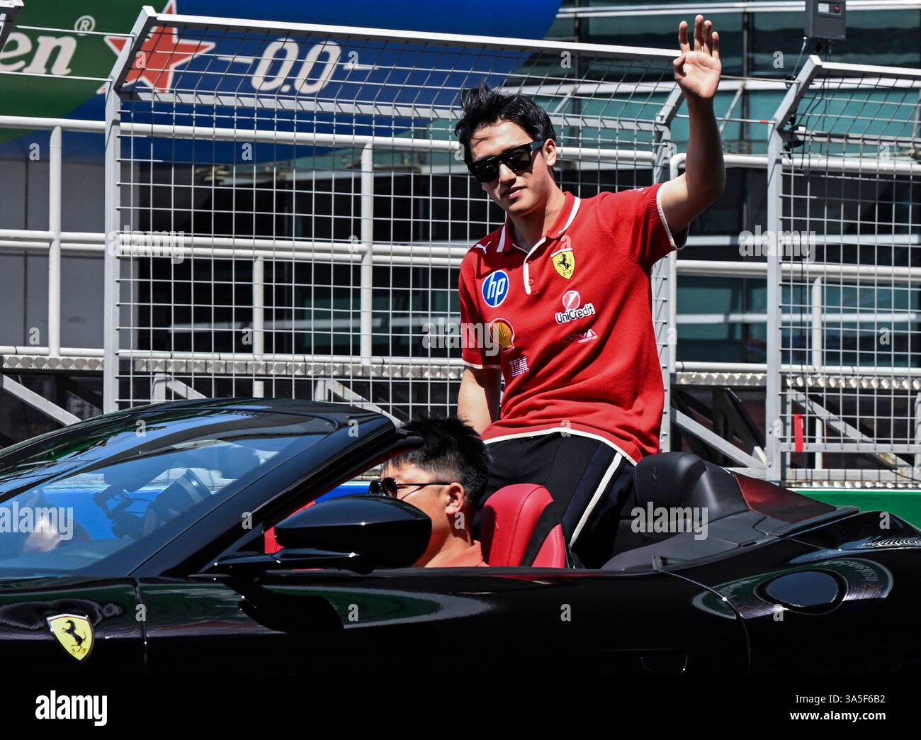 Shanghai. 22nd Mar, 2025. Ferrari's reserve driver Zhou Guanyu of China ...