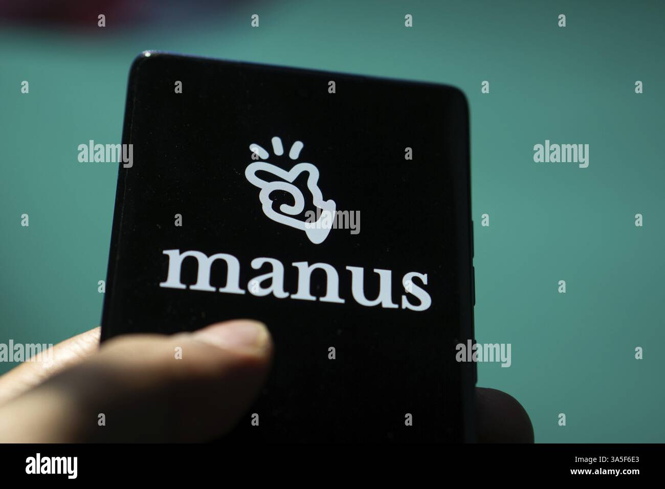 Close up of Manus logo on screen of mobile phone Stock Photo - Alamy