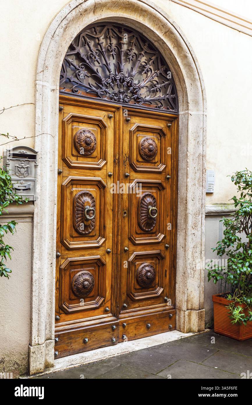 Magnificent massive wooden doors. The central square of tufa city of ...