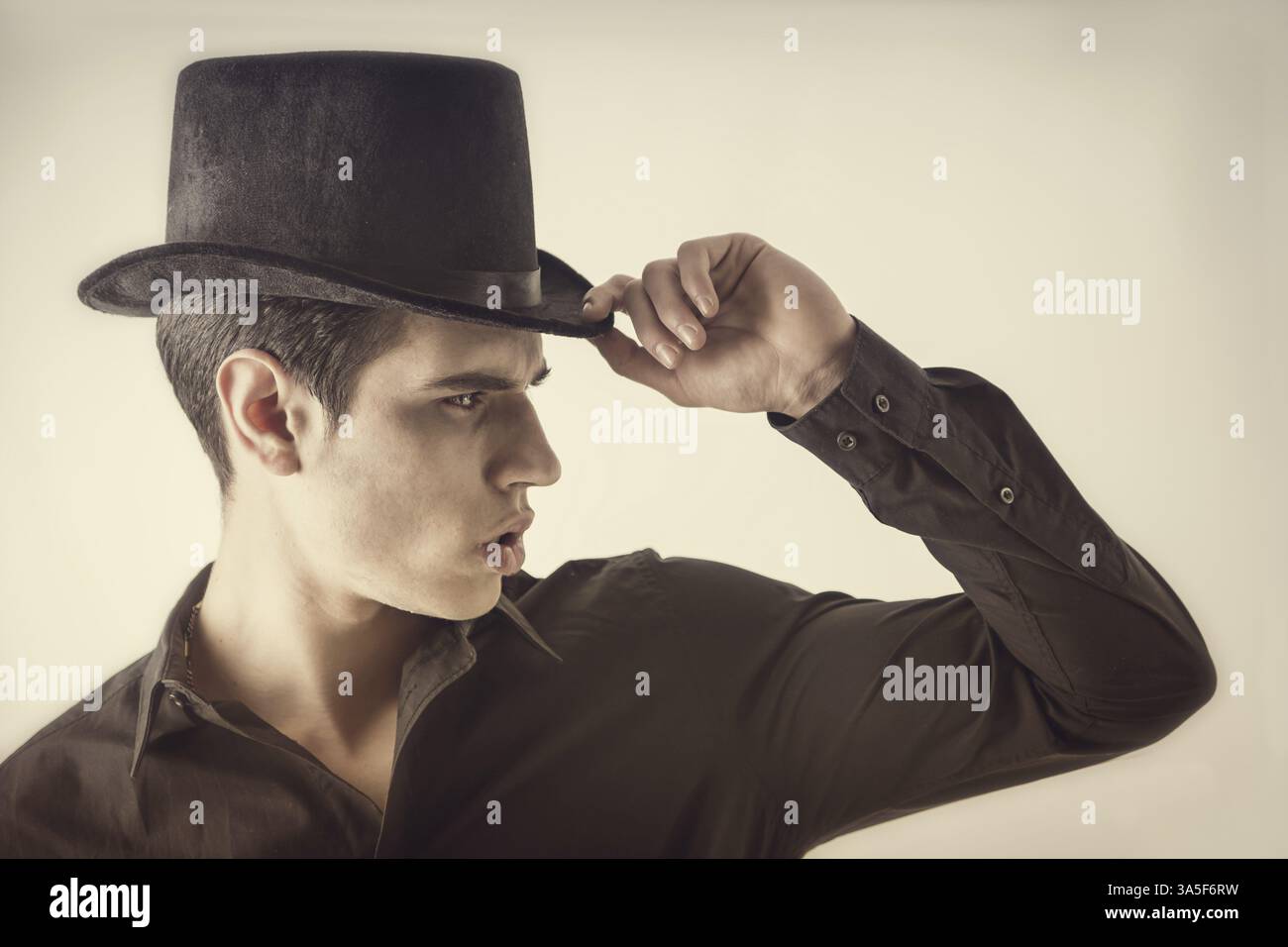 Portrait of a Young Vampire Man with Black Shirt and Top Hat, Tipping ...