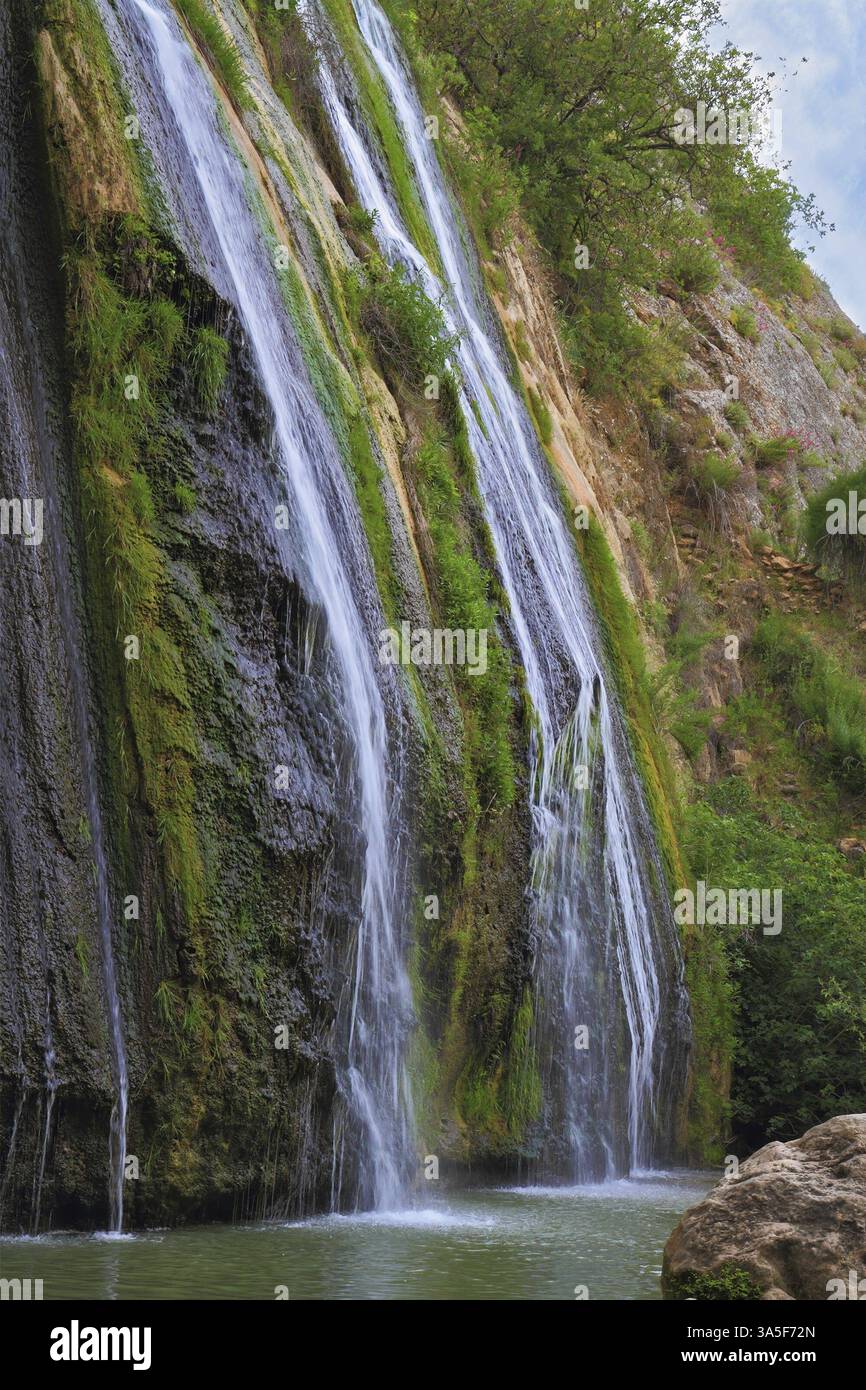 Three parallel stream running down the steep slope and fall into the ...