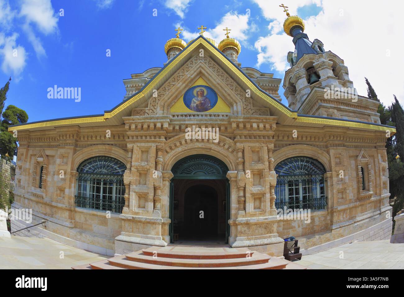 Above the triangular portico golden domes topped with golden crosses ...