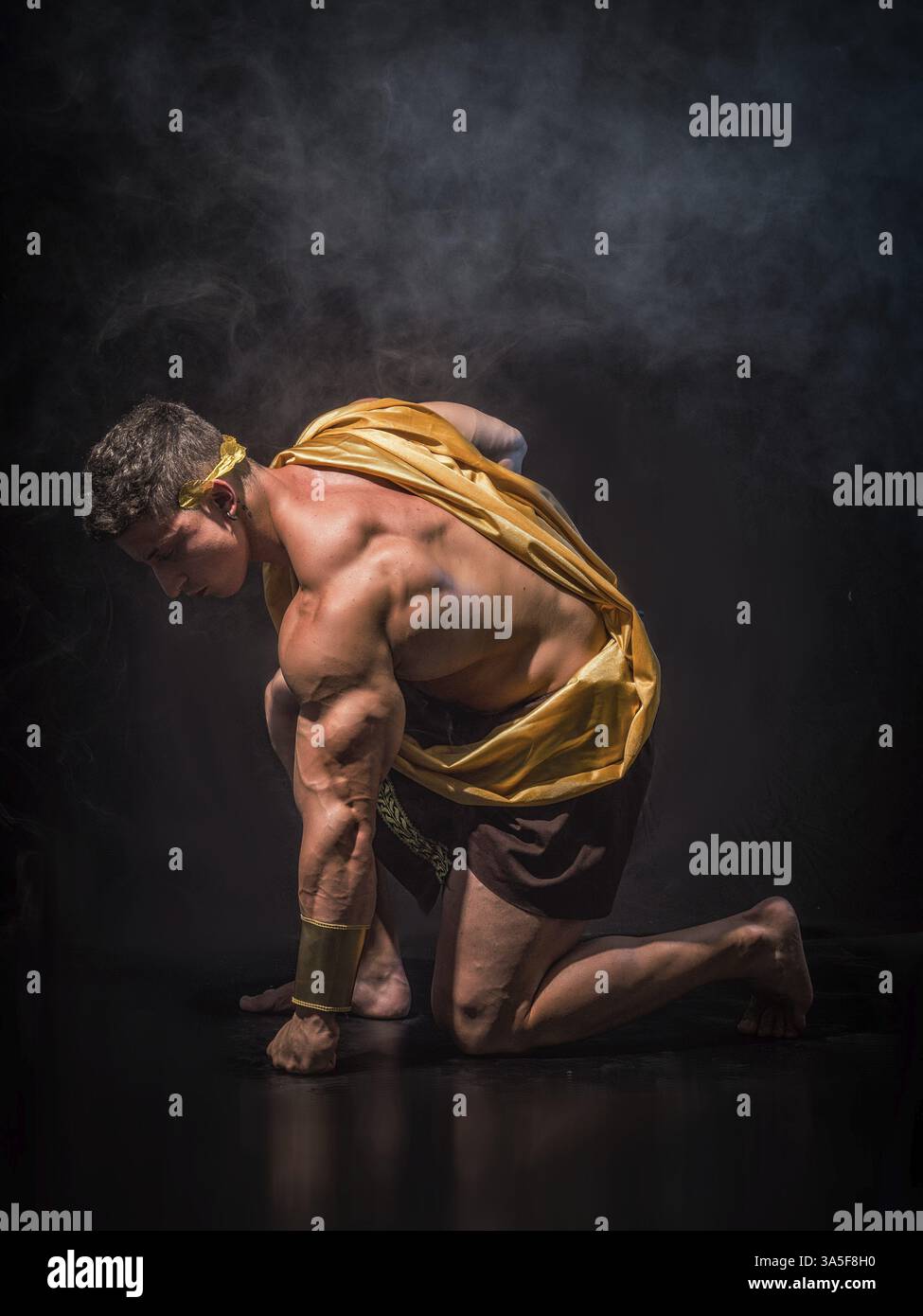 Serious young man in Greek god or Roman aristocrat costume with ...