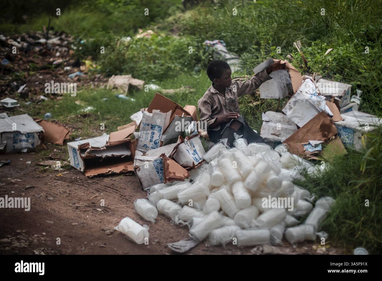 Child caught between plastic waste, pollution and poverty Kinshasa ...
