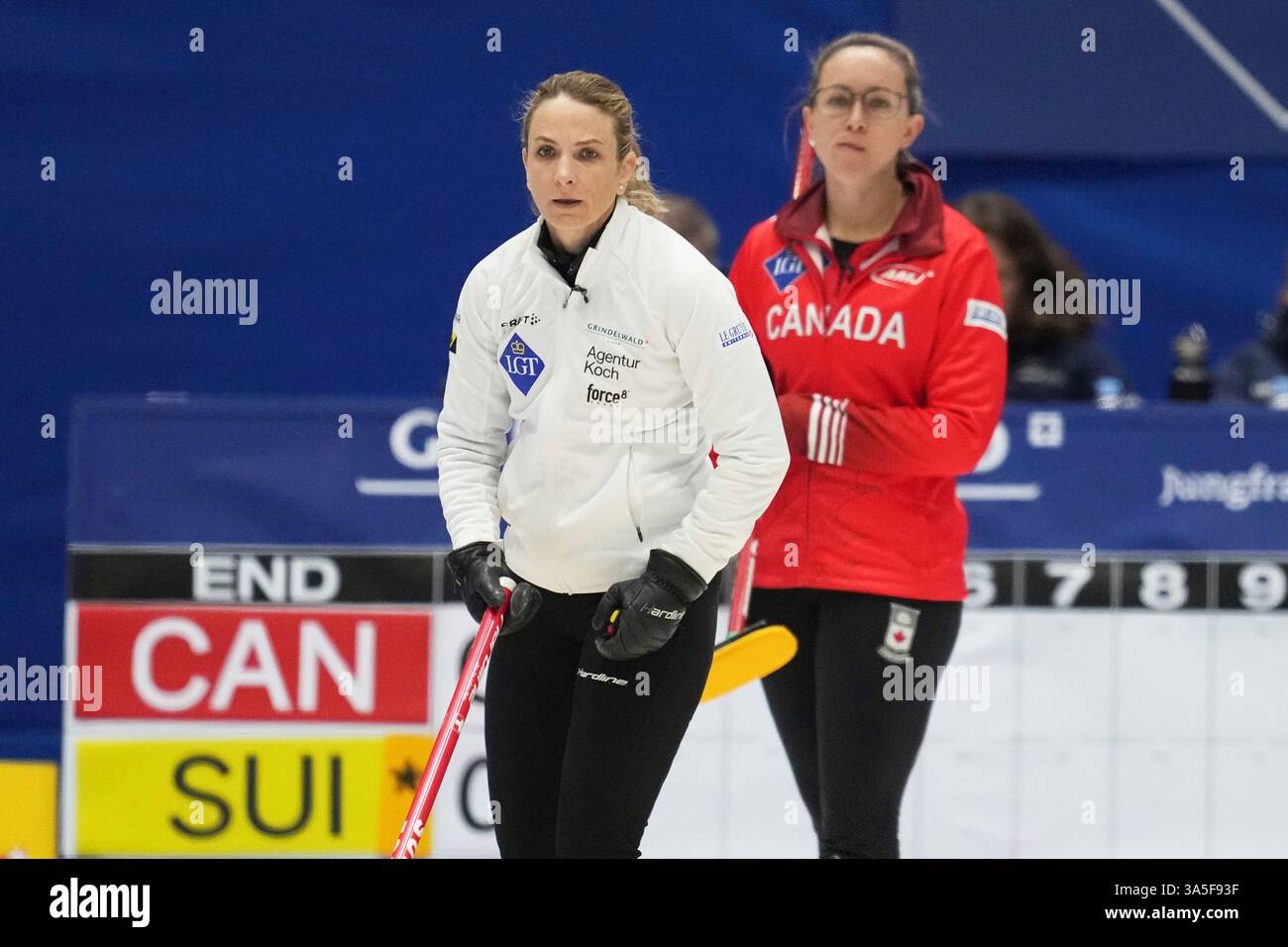 Switzerland's skip Silvana Tirinzoni, left, and Canada's skip Rachel ...