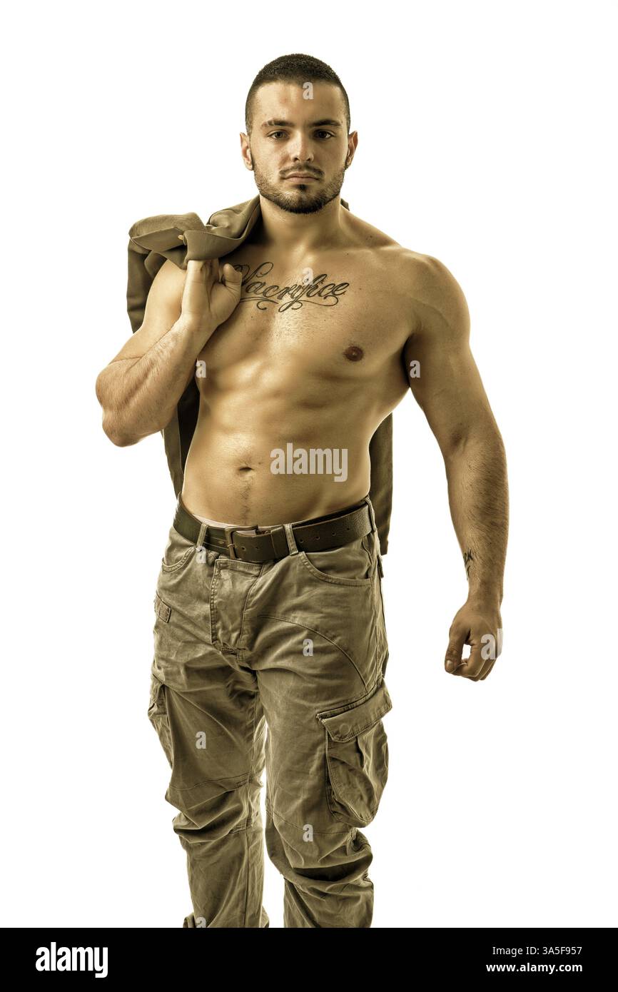 Confident muscular male bodybuilder during bulking phase or mass period ...