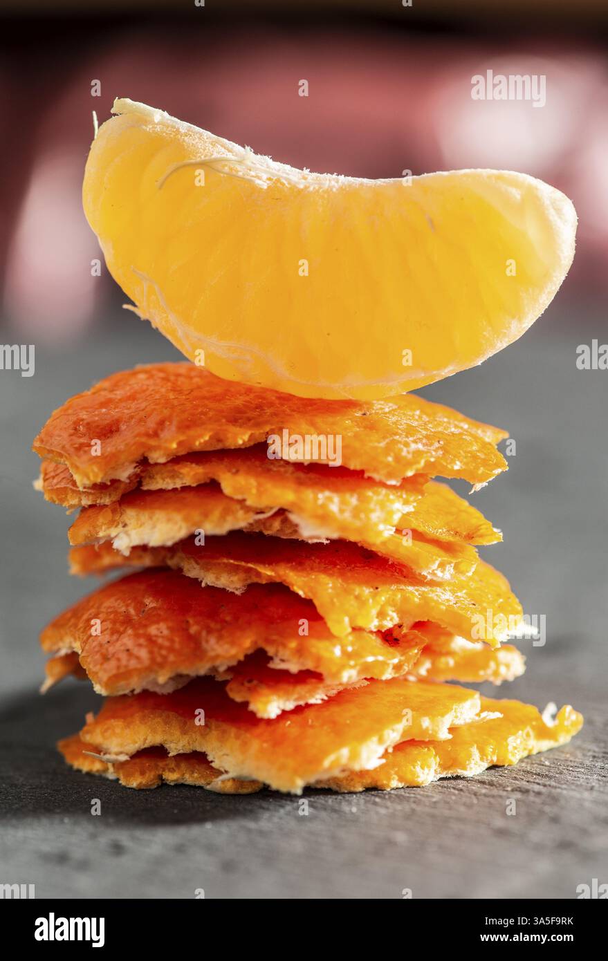 Stack of mandarin peel and a tangerine on top. Close-up shot of citrus ...