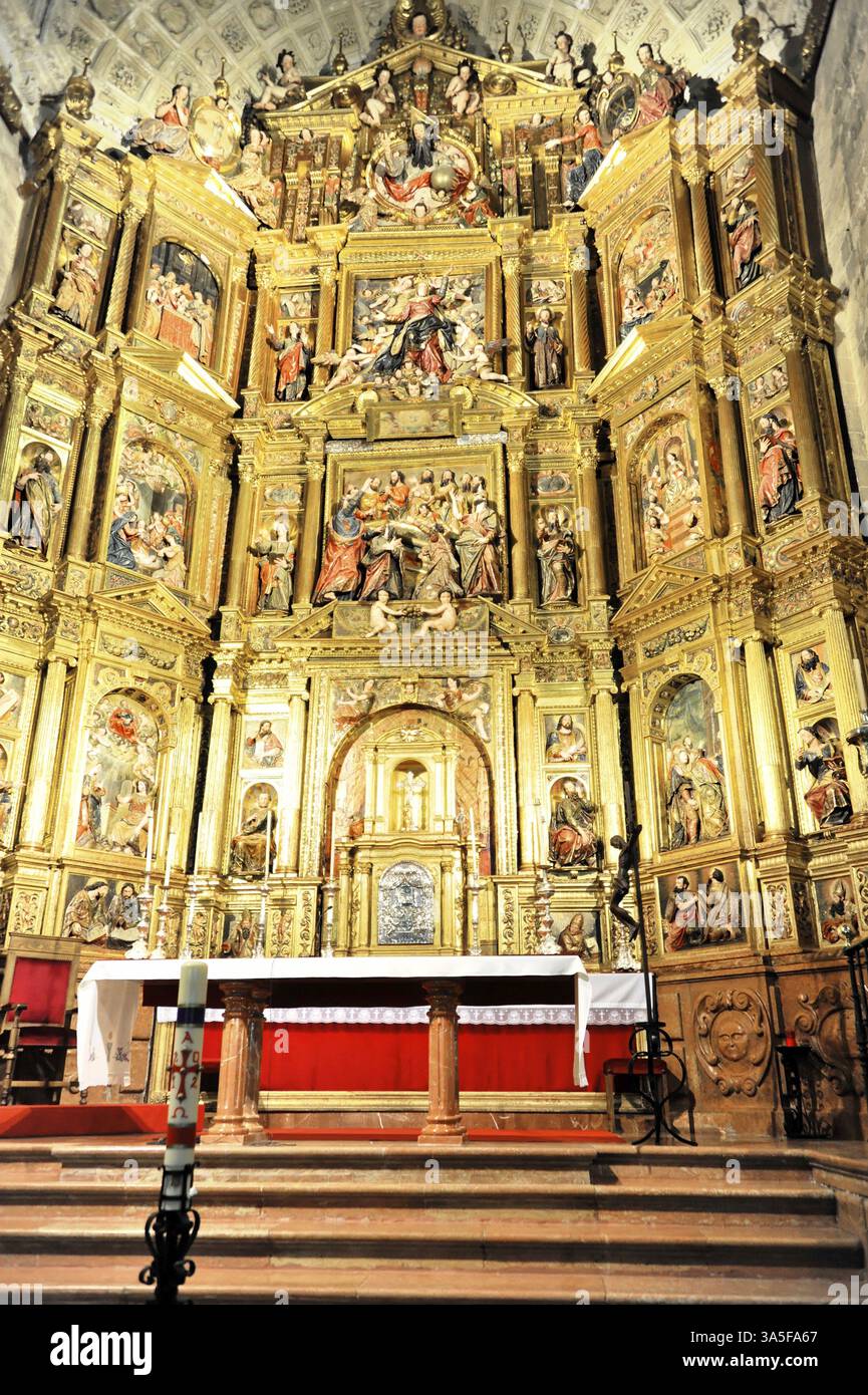 Magnificent baroque altar, richly decorated with paintings and golden ...