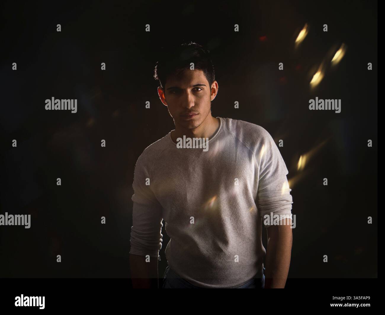 Half body shot of handsome young man with shirt, looking at camera, on ...