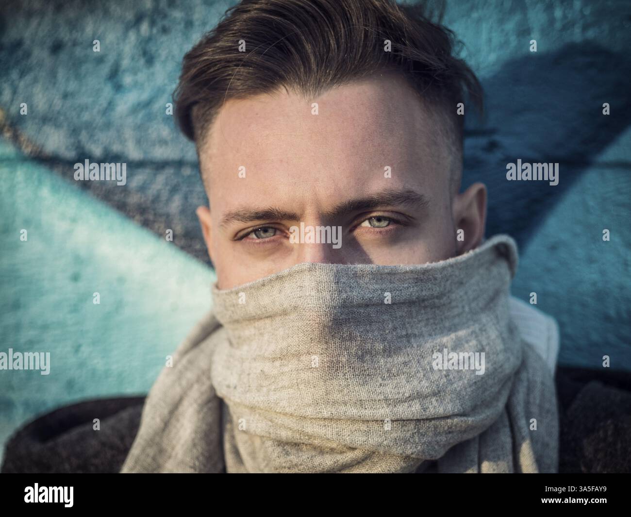 Cover nose with scarf hi-res stock photography and images - Alamy