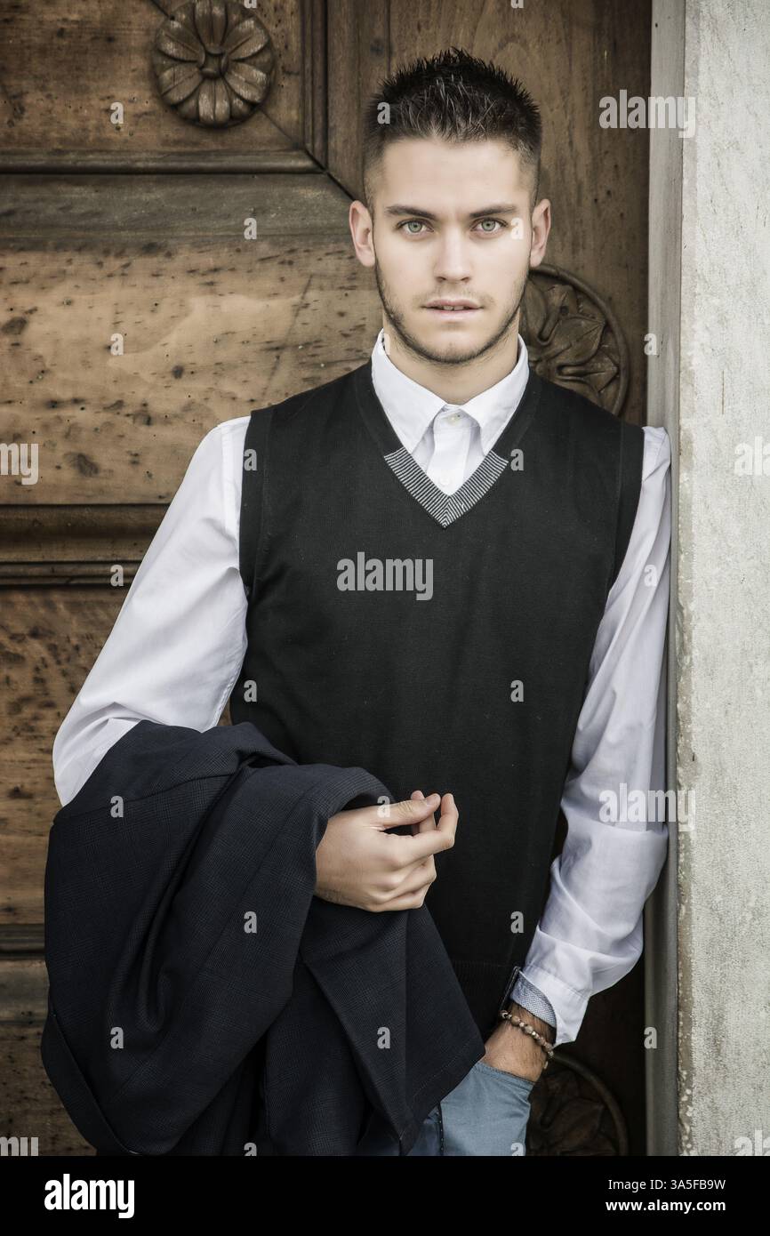 Handsome young man outdoor wearing jacket and shirt standing by ...