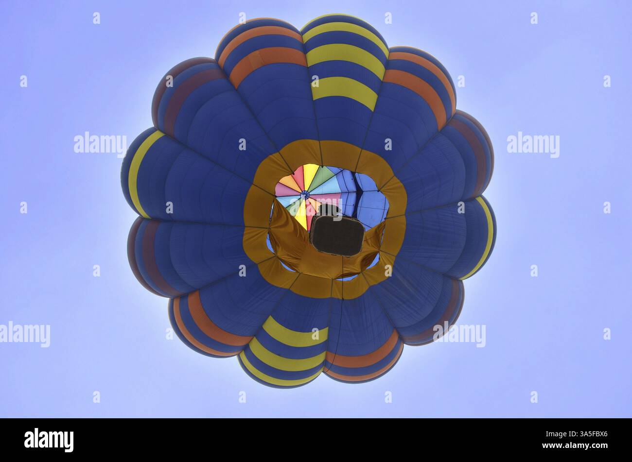 Single hot air balloon floating away Stock Photo - Alamy