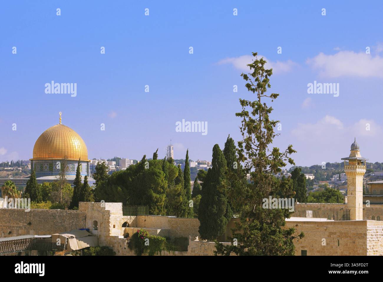 The Holy City of Jerusalem is lit by the morning sun. Golden Dome ...