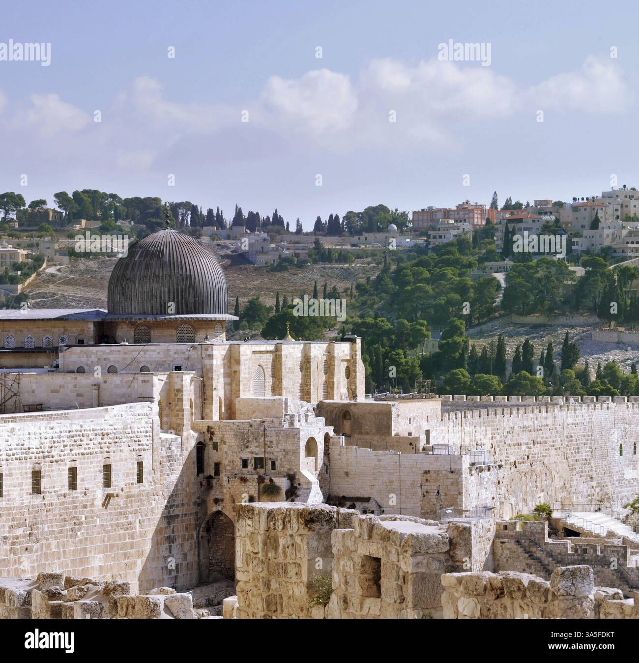 The walls of Jerusalem. In the distance you can see the gray dome of ...