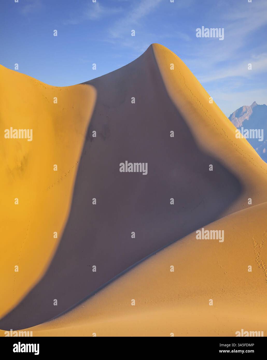 Bizarre twists of orange sand dune. Bright sunny morning in a Death ...