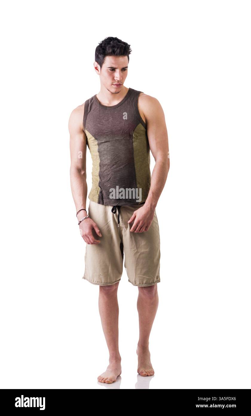 Full length shot of handsome guy wearing stylish half shorts and t ...