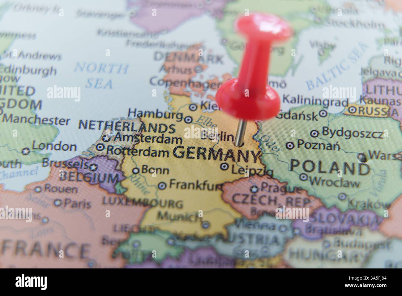 Close-up of a map with a red pushpin marking Germany. Travel, geography ...