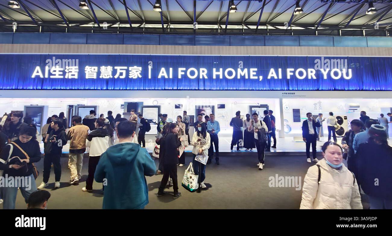 Shanghai, China. 20th Mar, 2025. Visitors visit the booth of Haier ...