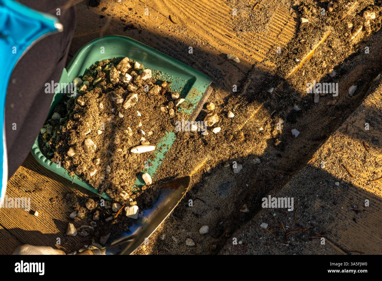 Laying slabs on a garden terrace, building a veranda, a floor made of ...