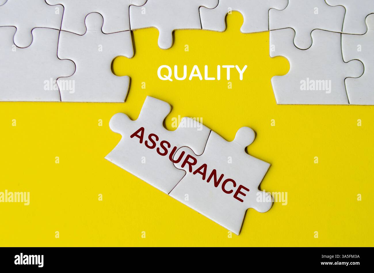 Top view of Quality Assurance text on jigsaw puzzle. Business Strategy ...
