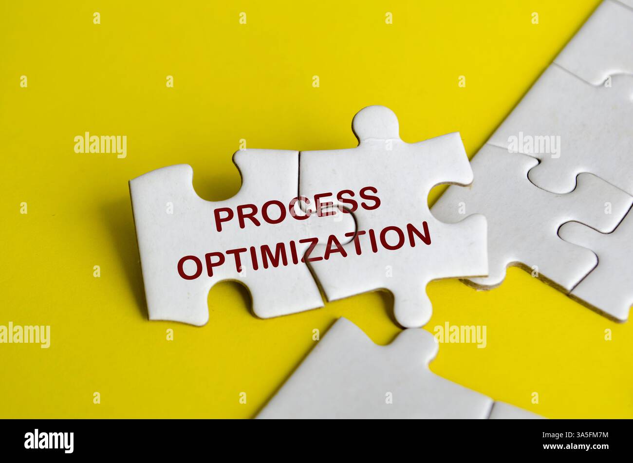 Process optimization text on jigsaw puzzle representing process ...