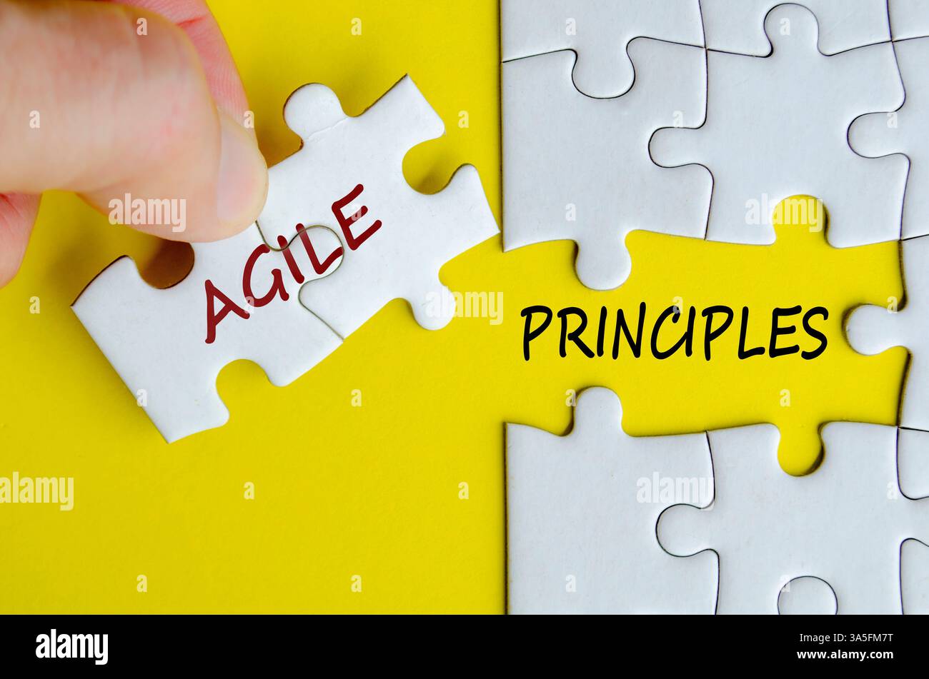 Agile Principles text on jigsaw puzzle representing flexible project ...