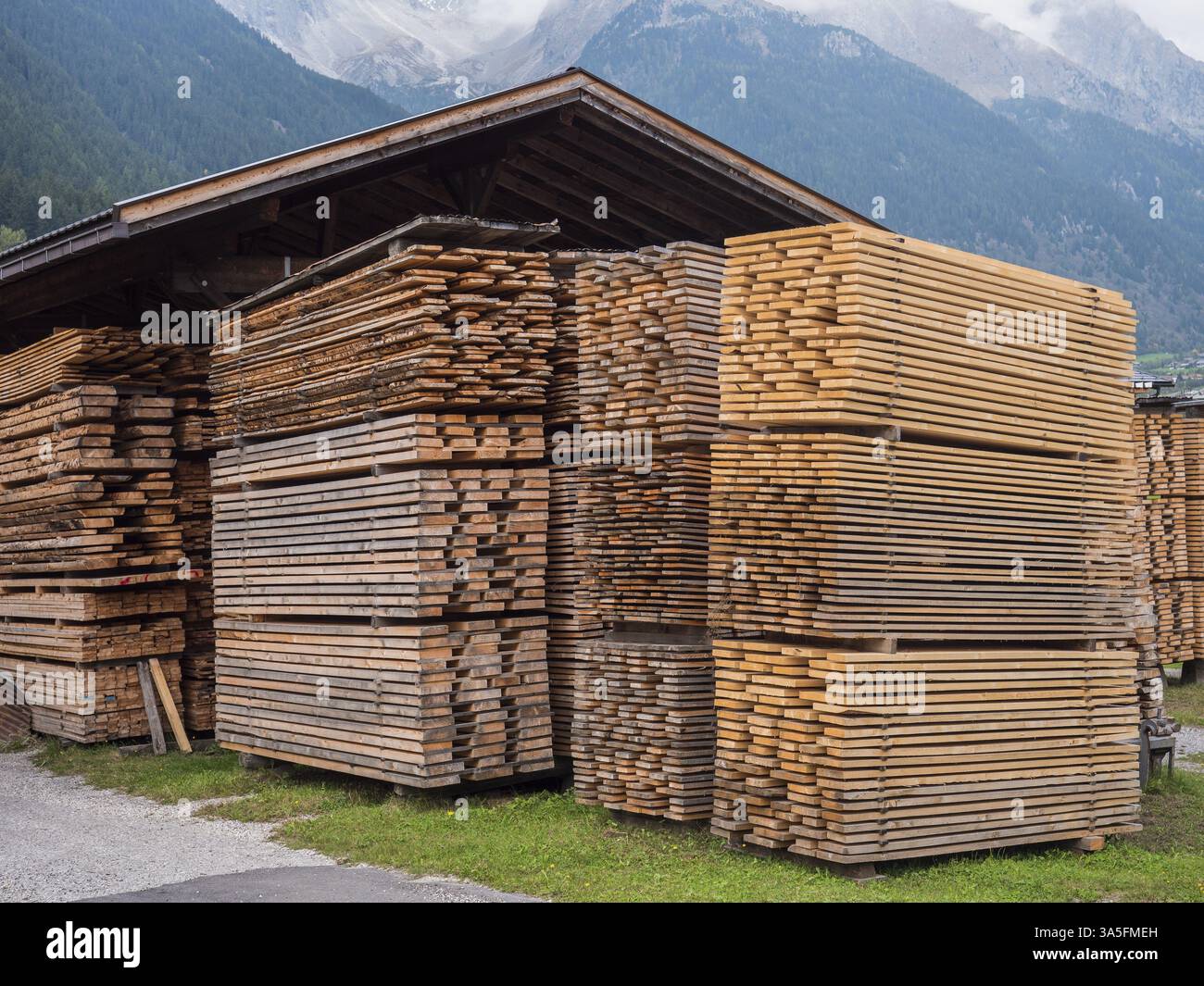 View wood planks stacked in huge piles in sawmill factory Stock Photo ...
