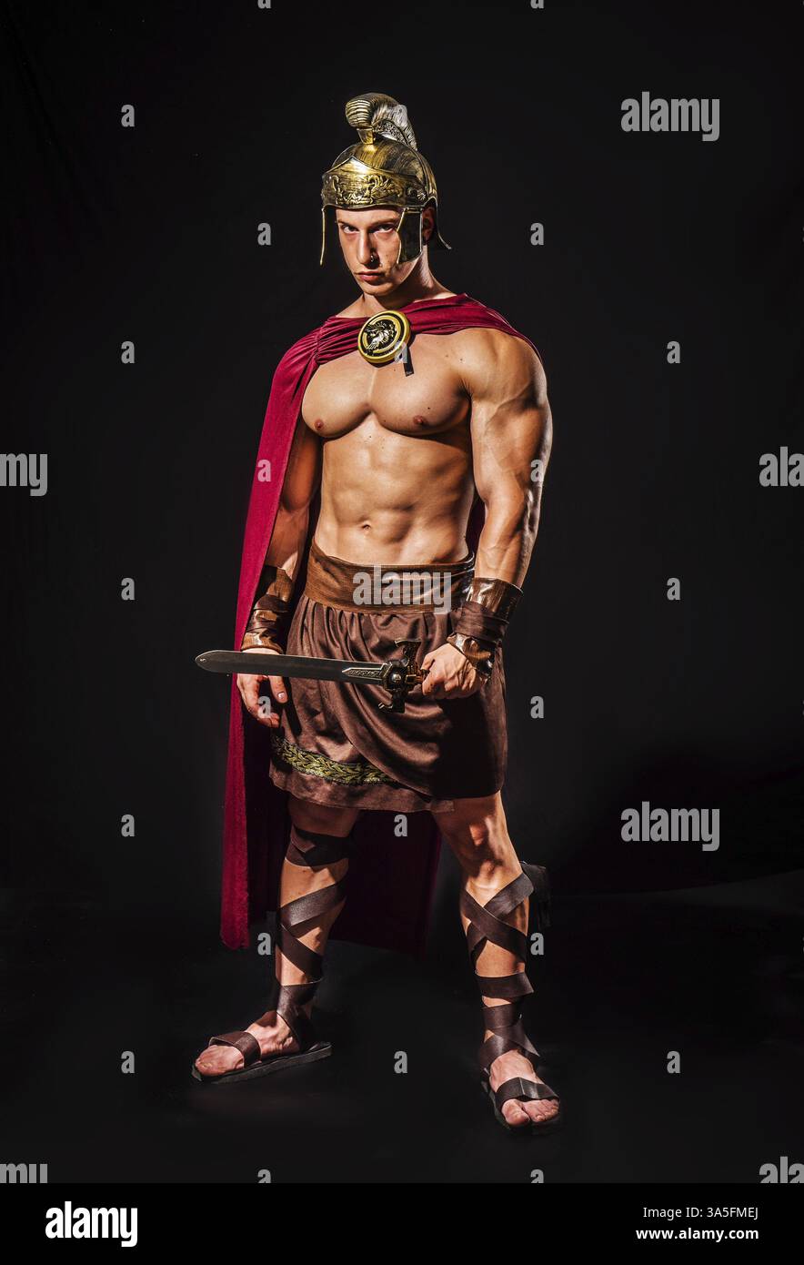 Young handsome muscular man posing in roman or spartan gladiator ...