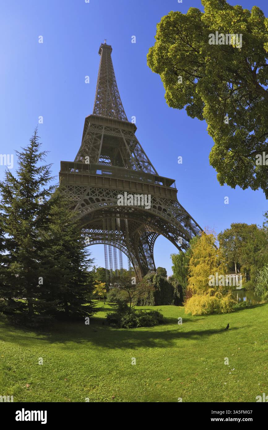 Travel Paris. Park at the foot of the Eiffel Tower. Unexpected angle ...