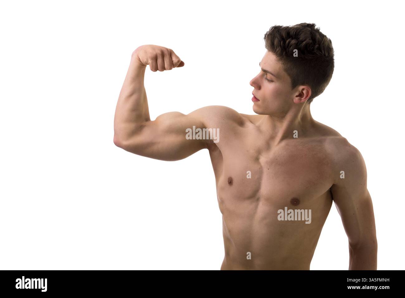 Handsome bodybuilder doing classic bicep pose, looking at arm, isolated ...