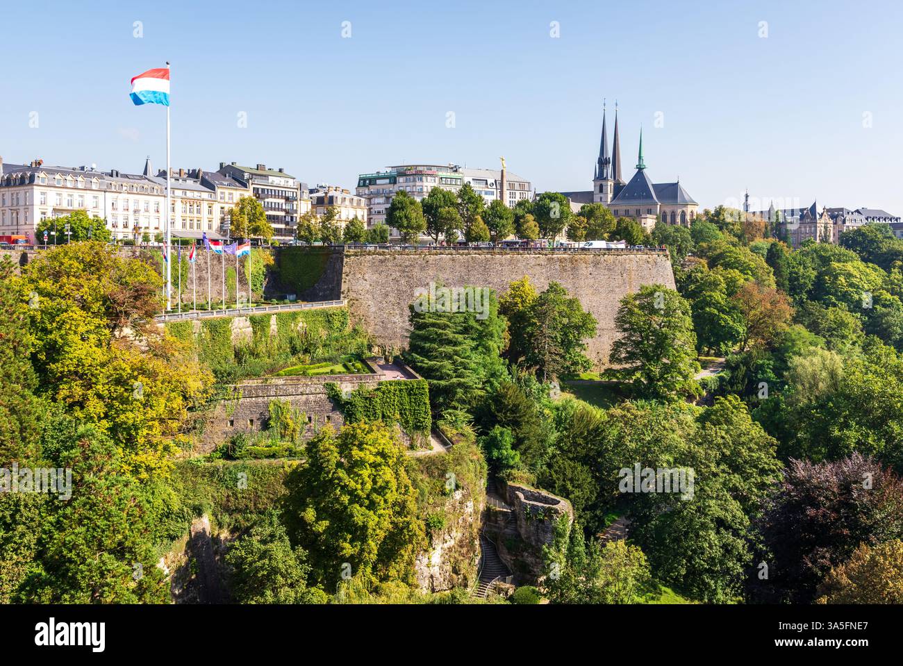 Old town in Luxembourg City with a Luxembourg flag, the Constitution ...