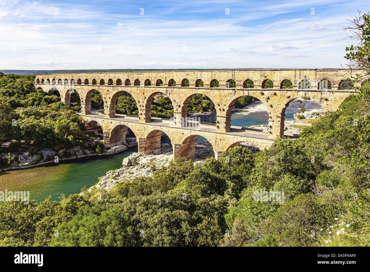 The aqueduct Pont du Gard is a three-tiered arcade. The Pont du Gard is ...