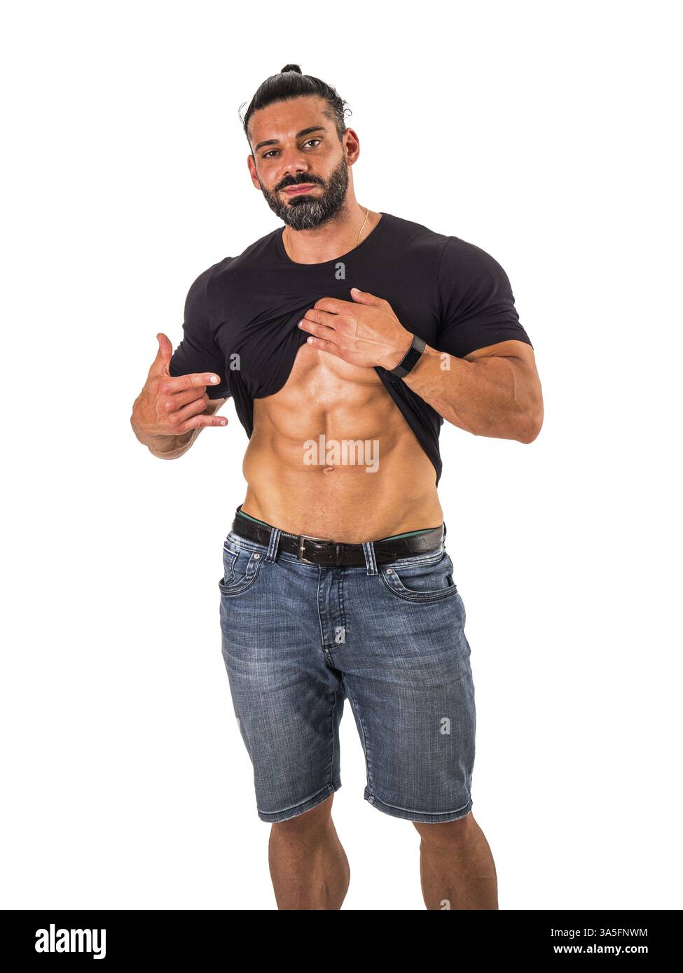 Handsome, muscular man pulling up t-shirt revealing abs. Isolated on ...