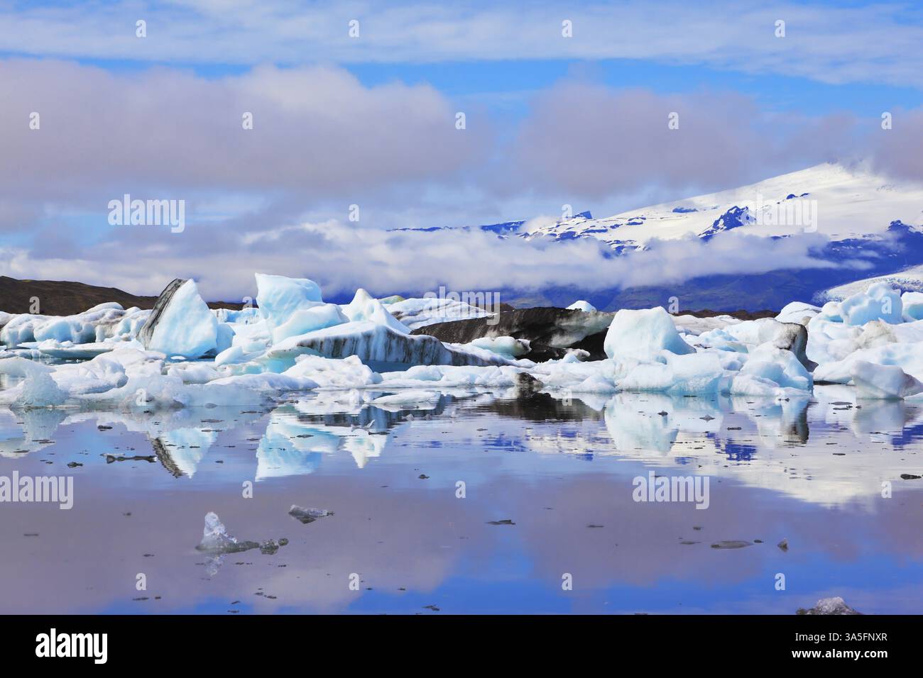 The Arctic Ocean. Iceland. Floating ices reflected in the lagoon ...