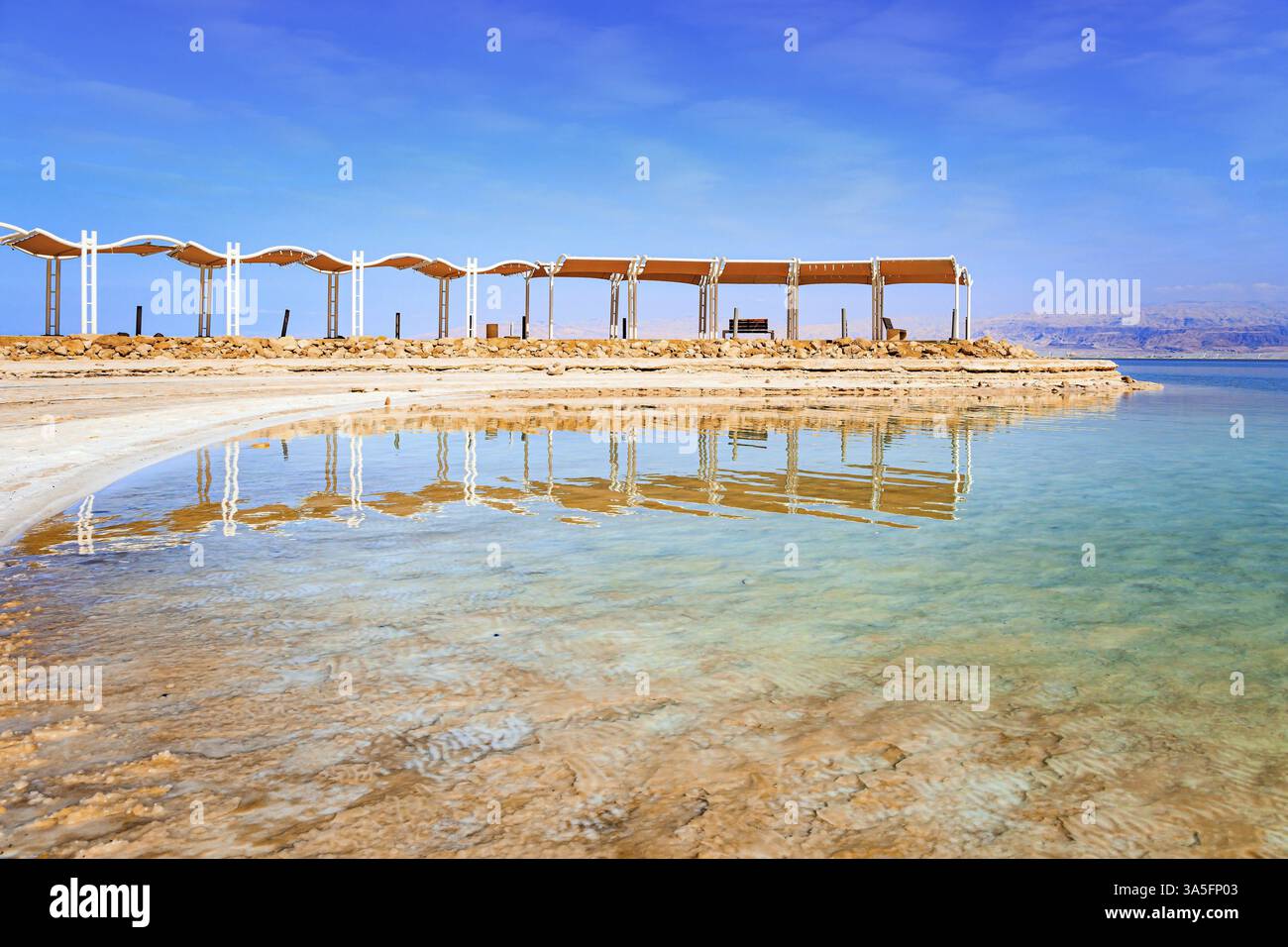 Long covered gallery on the beach. The Dead Sea is an endorheic, very ...