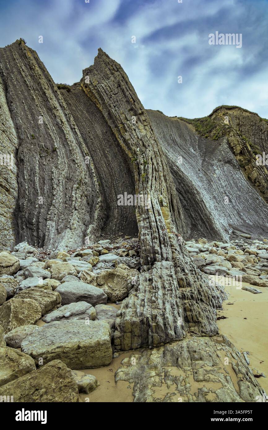 Cantabria Beaches, Portio Beach. Giant rough gray rocks and smooth ...