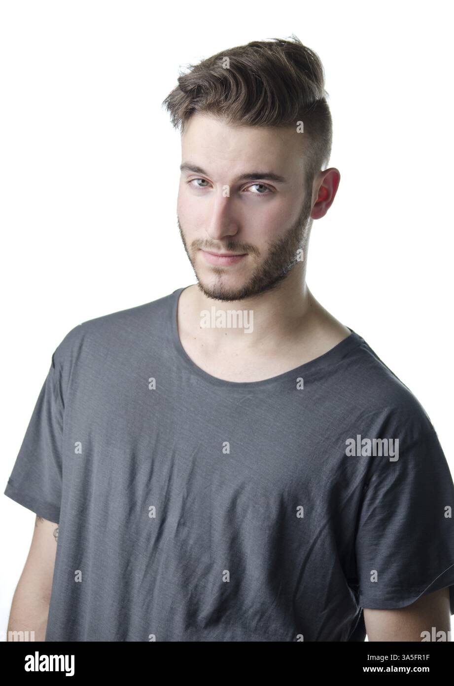 Handsome young man looking in camera with nice, cute expression ...