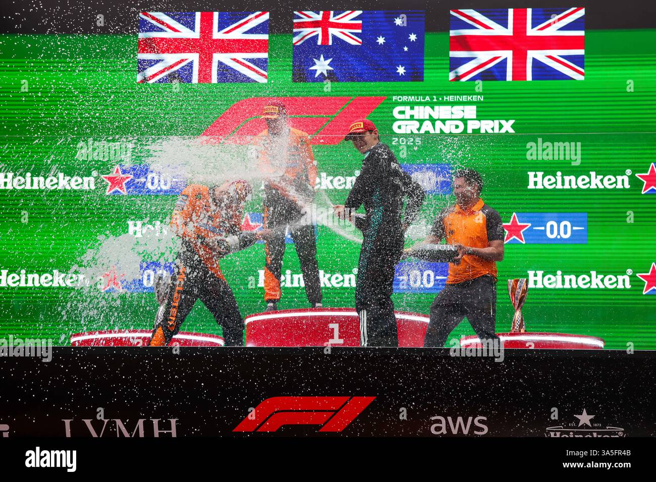 Oscar Piastri, Lando Norris, George Russell, Podium celebration after ...