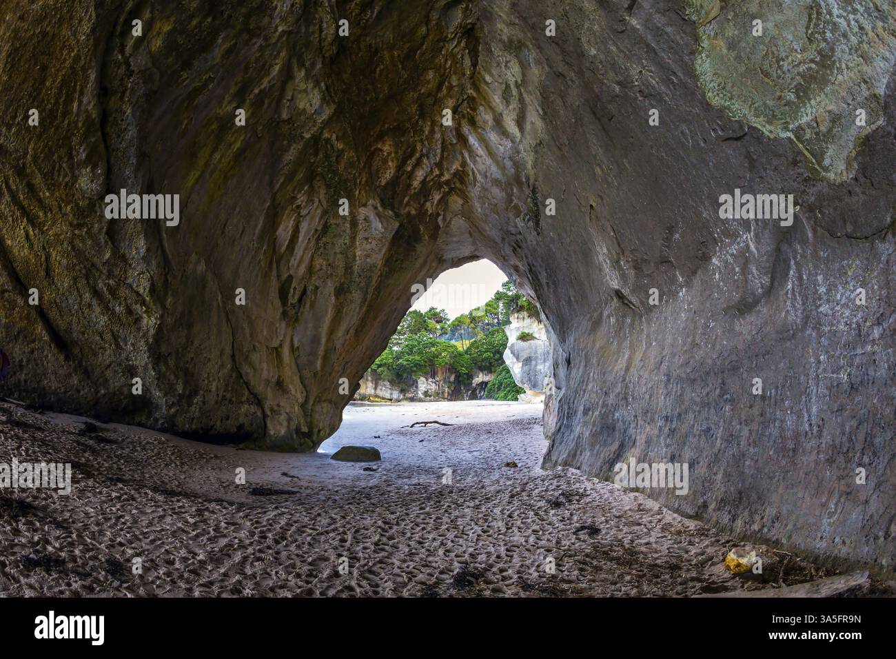 The magnificent fantastic Cathedral Cave on the sandy beach. Low tide ...