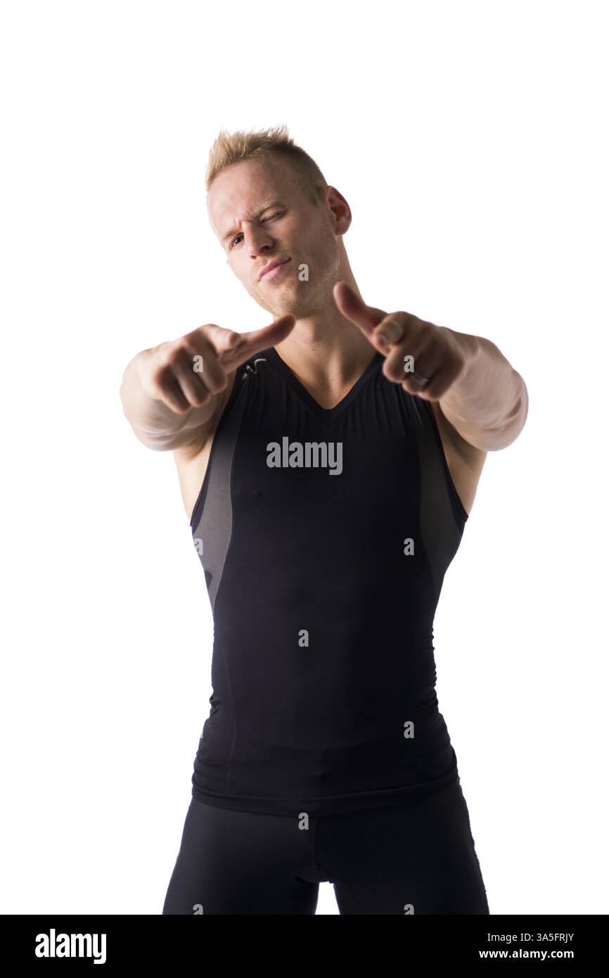 Fit male model with a lot of confidence smiling and pointing fingers to ...