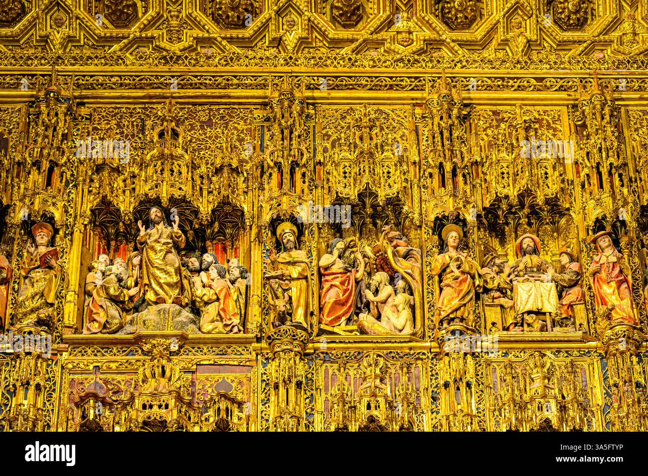 Low-angle view of the main altar featuring a group of statues of ...