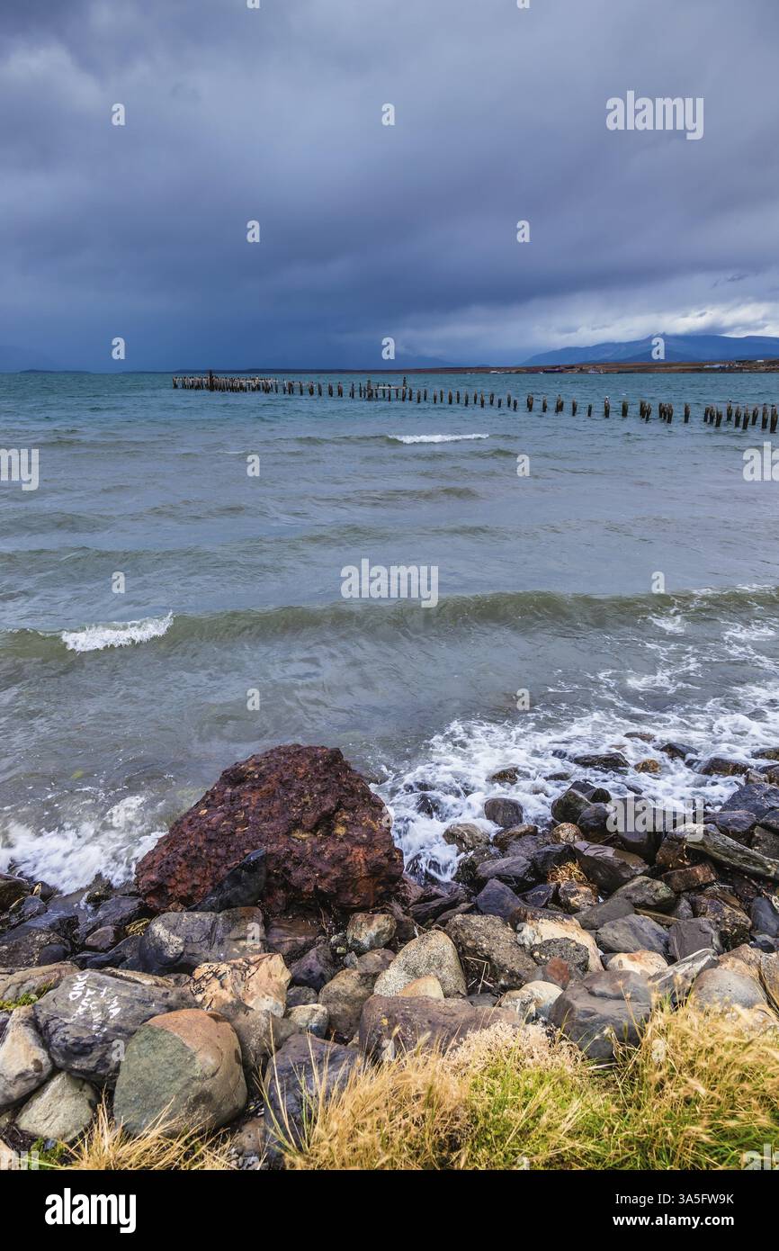 Strait of Magellan summer day. Waterfront, Punta Arenas. Piles of ...