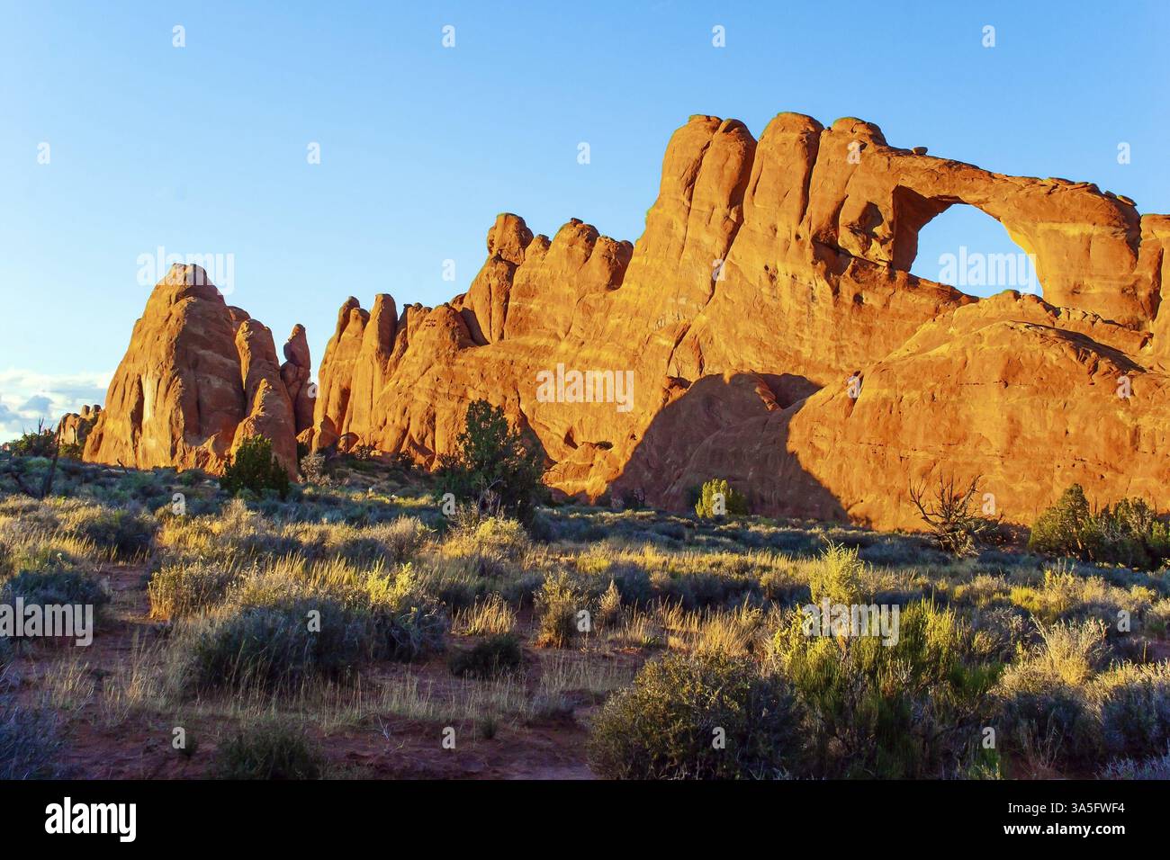 Picturesque red-brown sandstone cliffs form a unique landscape. Skyline Arch. The unique beauty ...