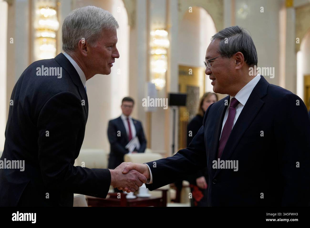 Chinese Premier Li Qiang, right, greets Cargill CEO Brian Sikes, from a ...