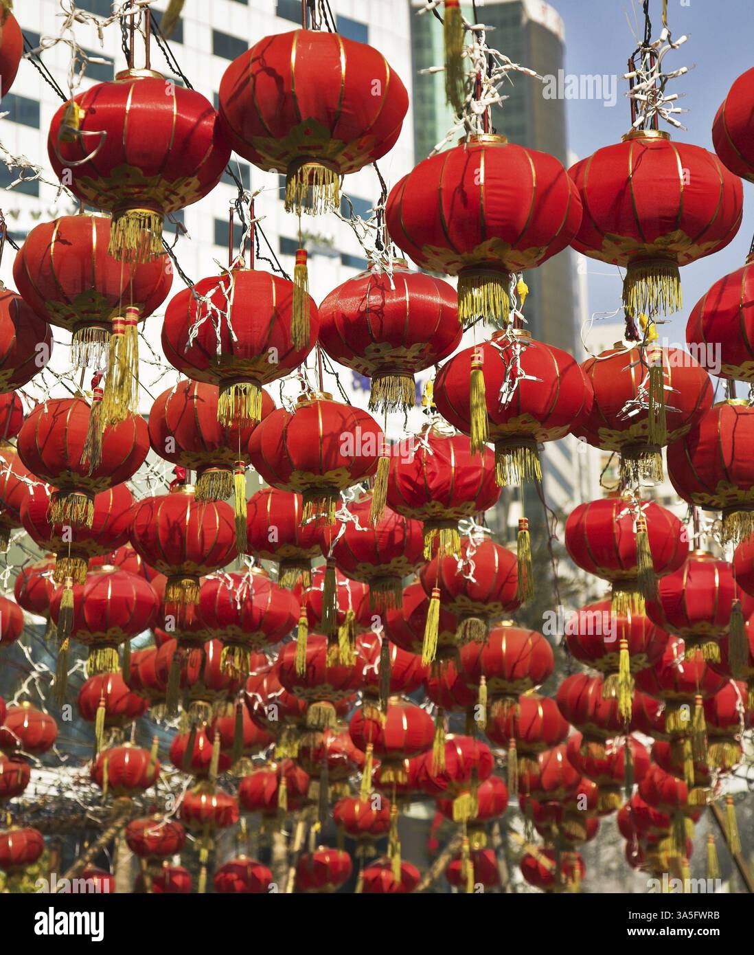 The traditional red lanterns decorating modern skyscrapers, in the ...