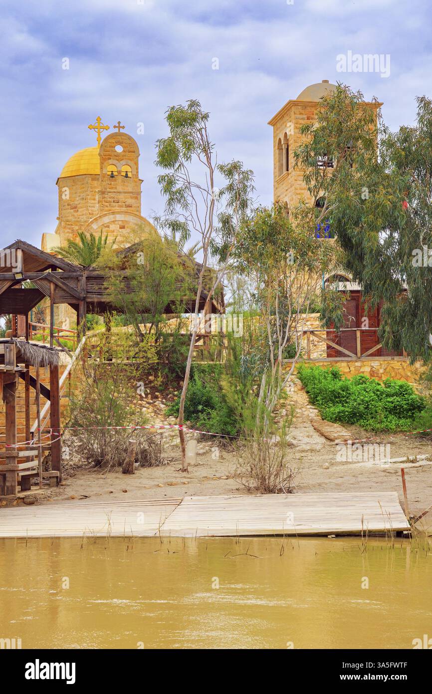 The Jordan River - state border between Israel and Jordan. Yellow water ...