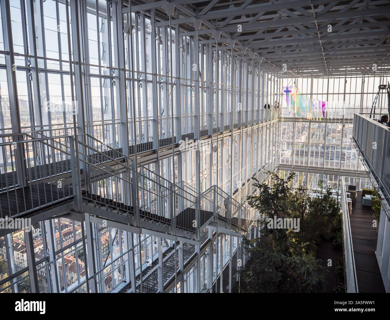 From above shot of huge glass interior building with stairs and levels ...