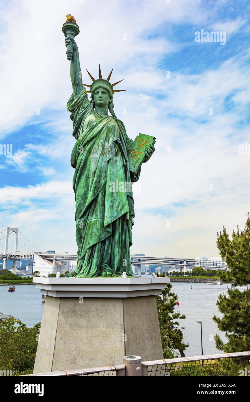 Embankment on the island of Odaiba. Japan. The Statue of Liberty in ...